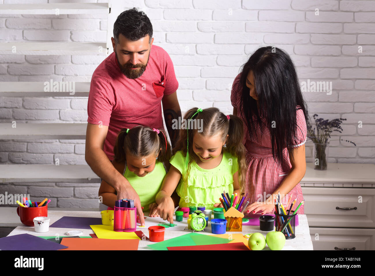 Children playing and learning with parents Stock Photo - Alamy
