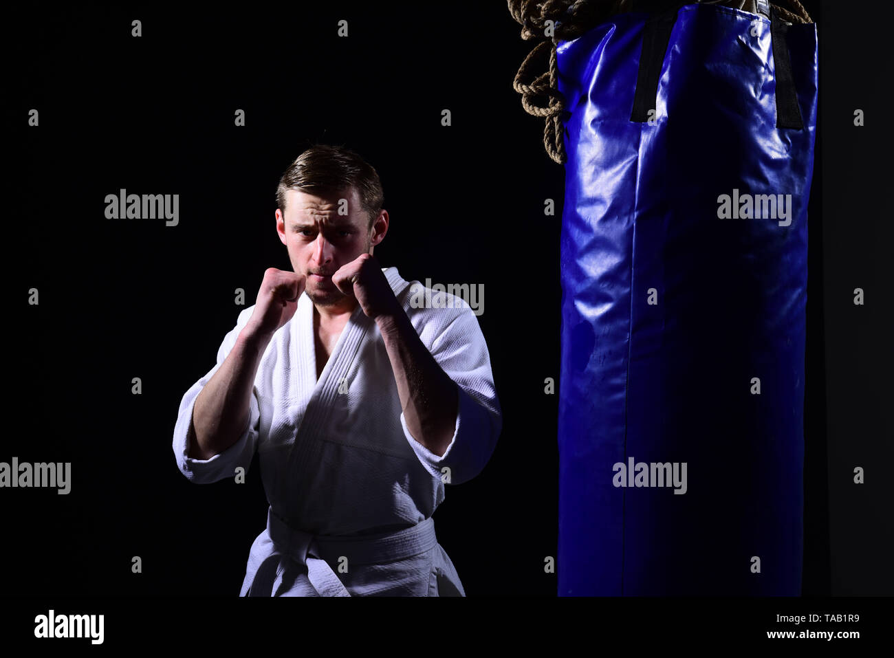 Fight concept. Sportsman ready for fight. Karate man in fight club ...