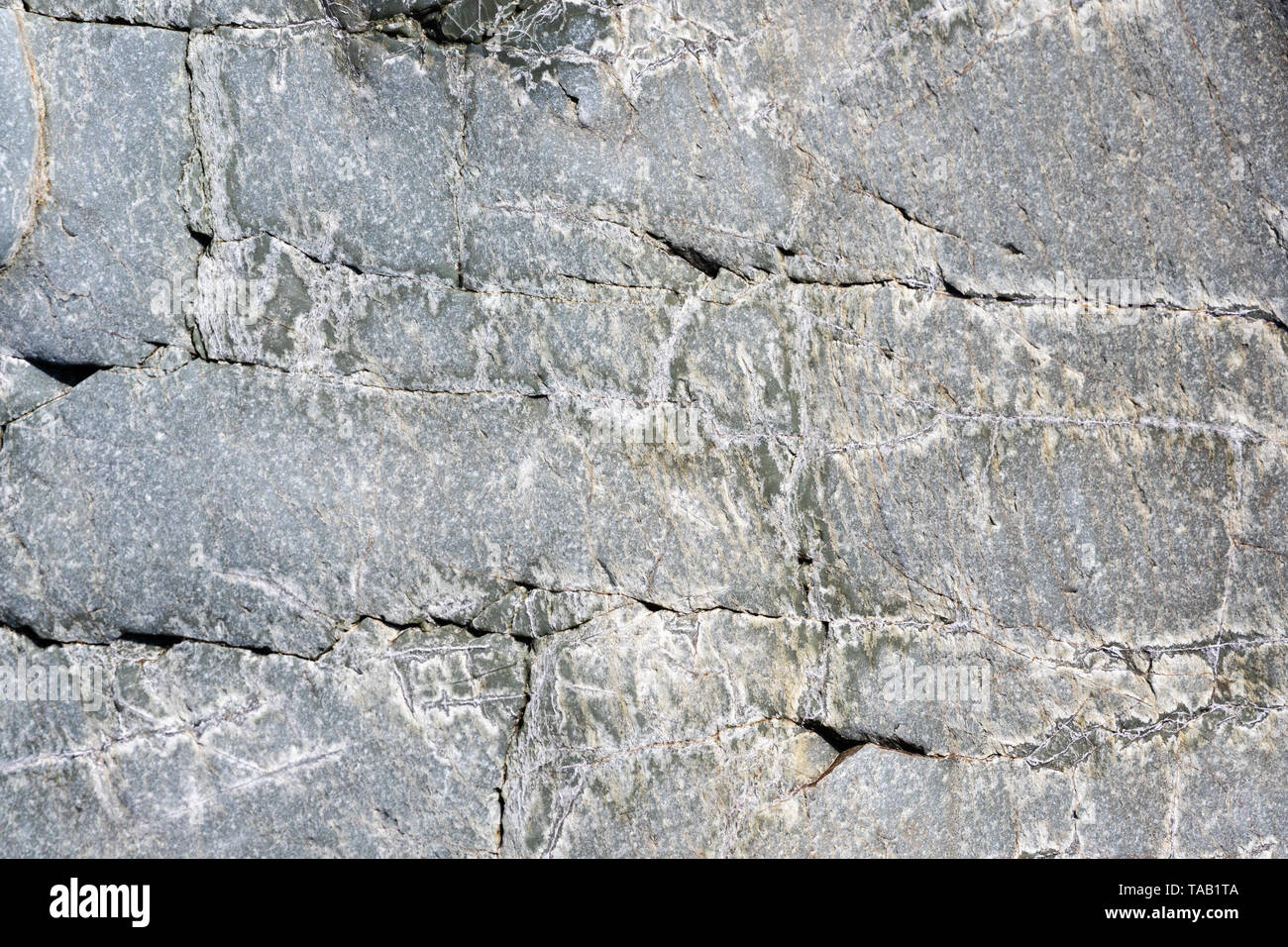 Close-up macro view of rough stone surface grey color. Detailed nature ...