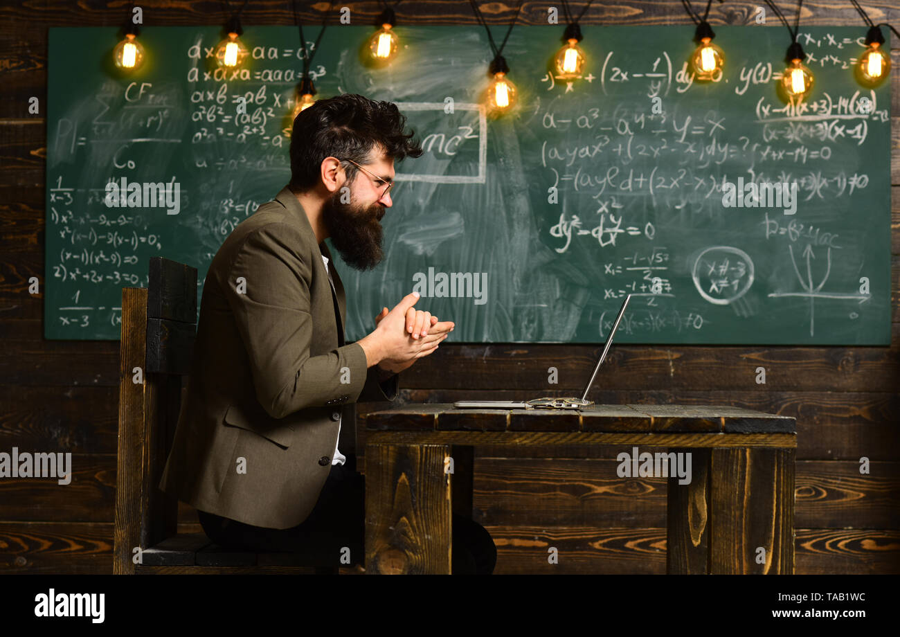 Business tutor typing on laptop at workplace in classroom, Teacher puts ...