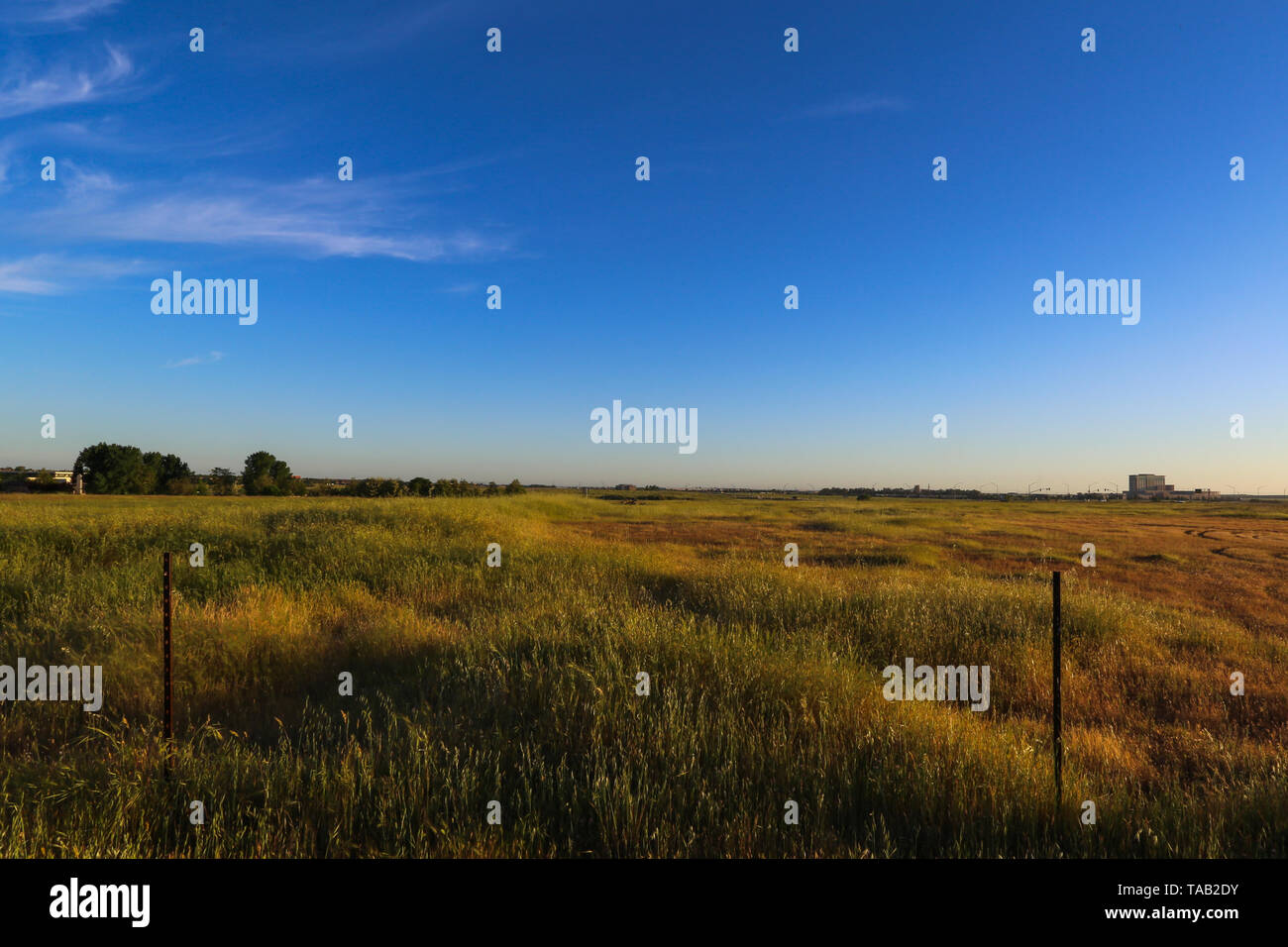 Wide angle shot with blue sky and clouds over an open field Stock Photo ...