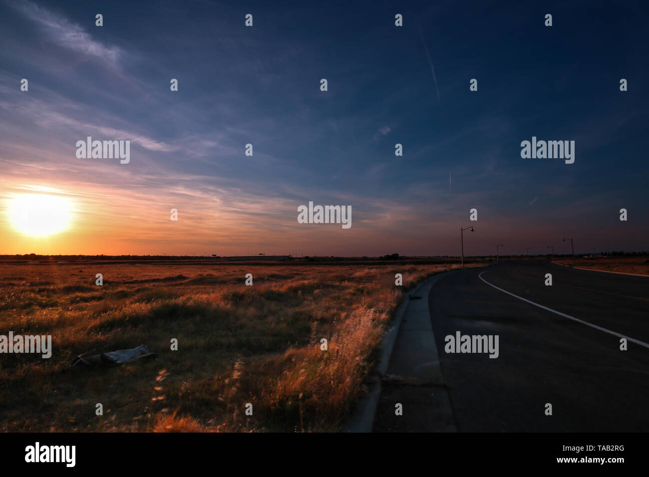 Sun setting road hi-res stock photography and images - Alamy