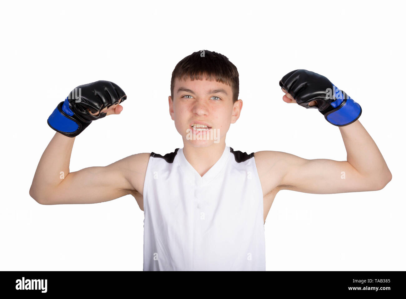 Caucasian teenage boxer flexing his muscles Stock Photo - Alamy