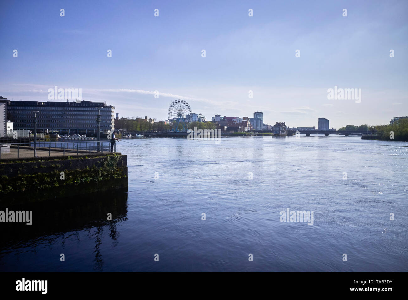 River Shannon in Limerick with a lone fisherman in the late afternoon ...