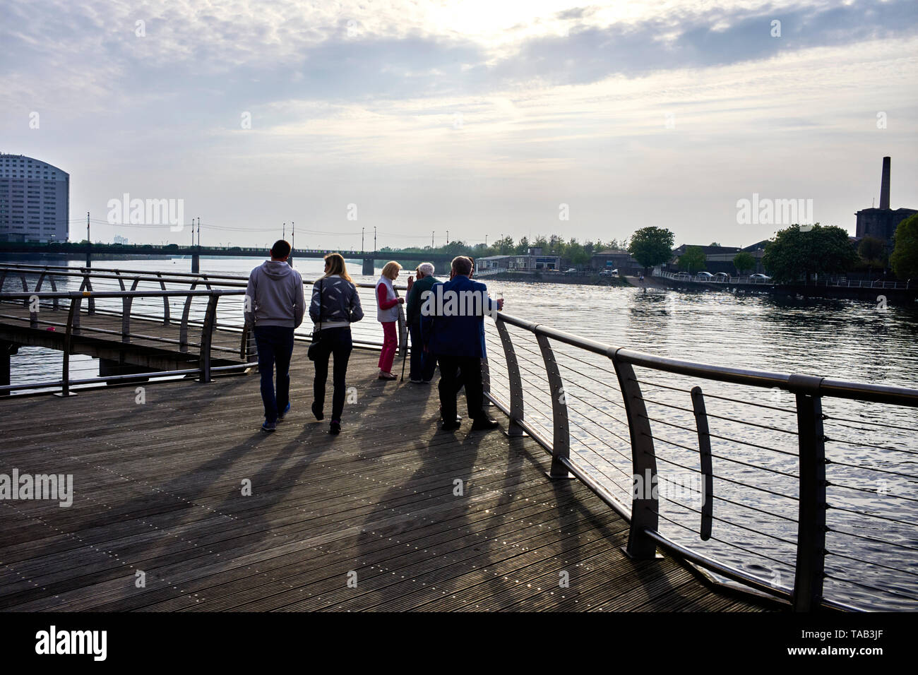 The walkway along the waterfront in Limerick, Ireland with the river ...
