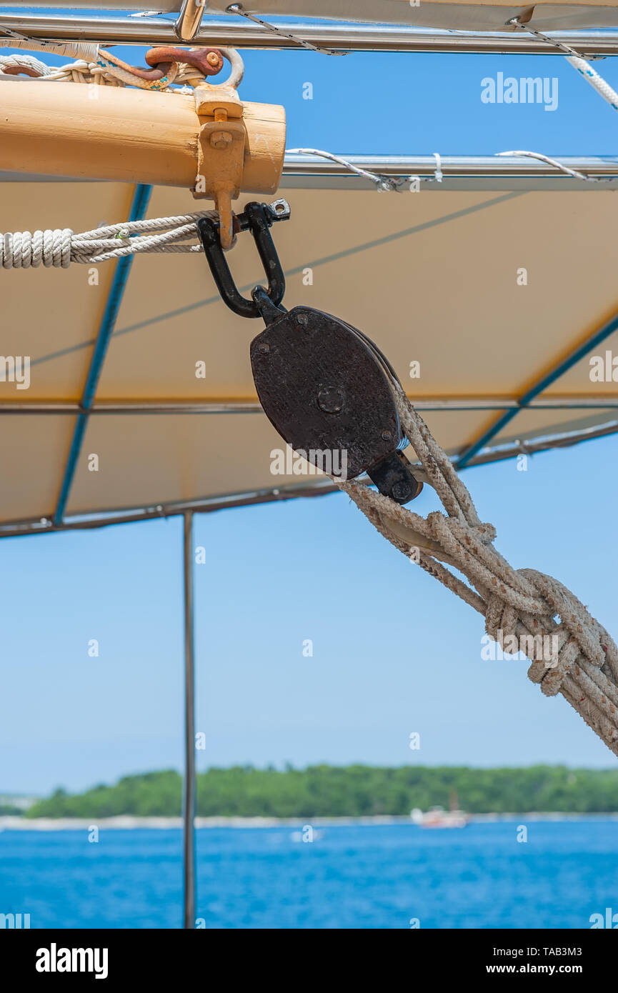 Fastening ropes sails on a sailing ship. Details of the ship. Close up ...