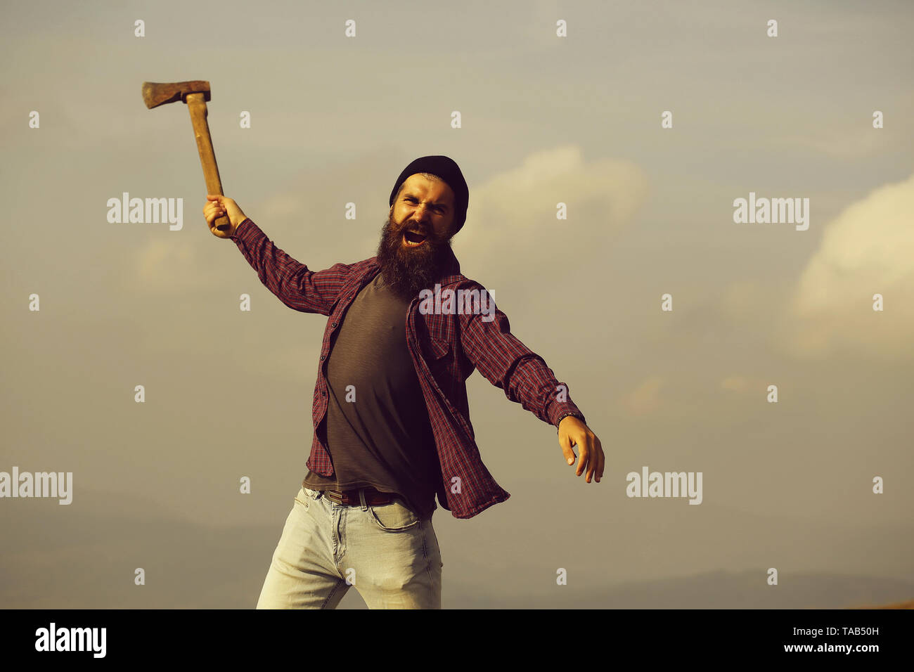 bearded man with ax on mountain Stock Photo - Alamy