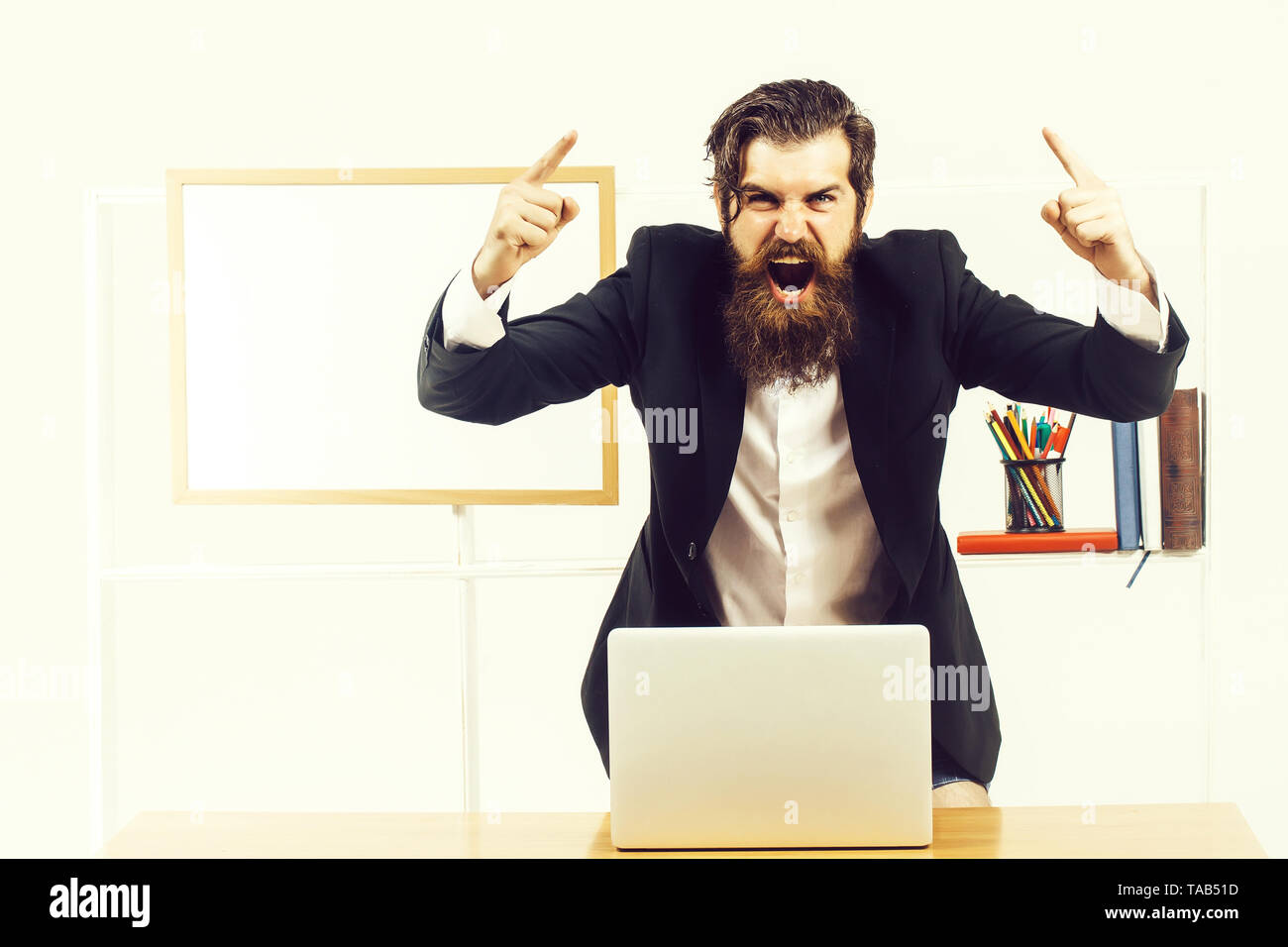 Businessman lifting fingers up Stock Photo - Alamy