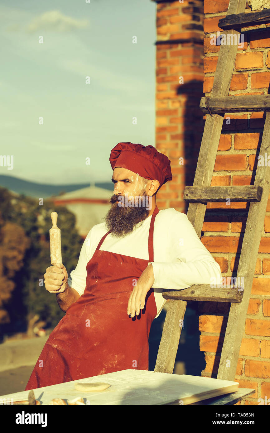 Man chief with rolling pin Stock Photo - Alamy