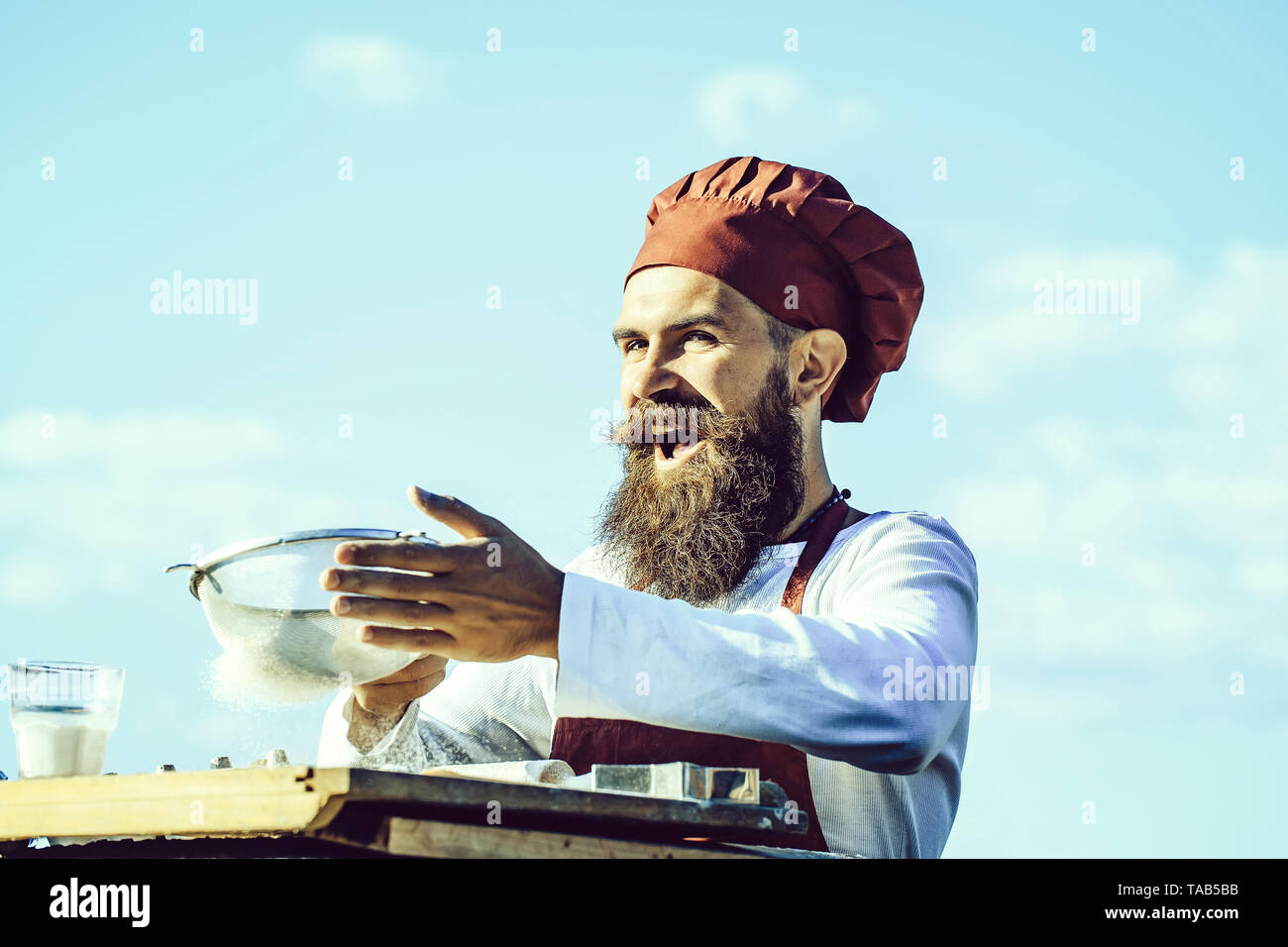 Man chef bolting flour Stock Photo - Alamy
