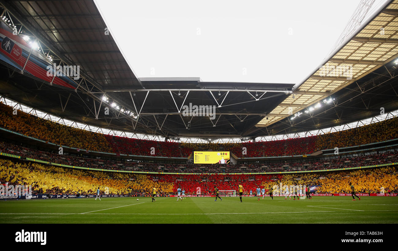 Watford fans wave red and yellow flags in support of theit side at 5-0 ...