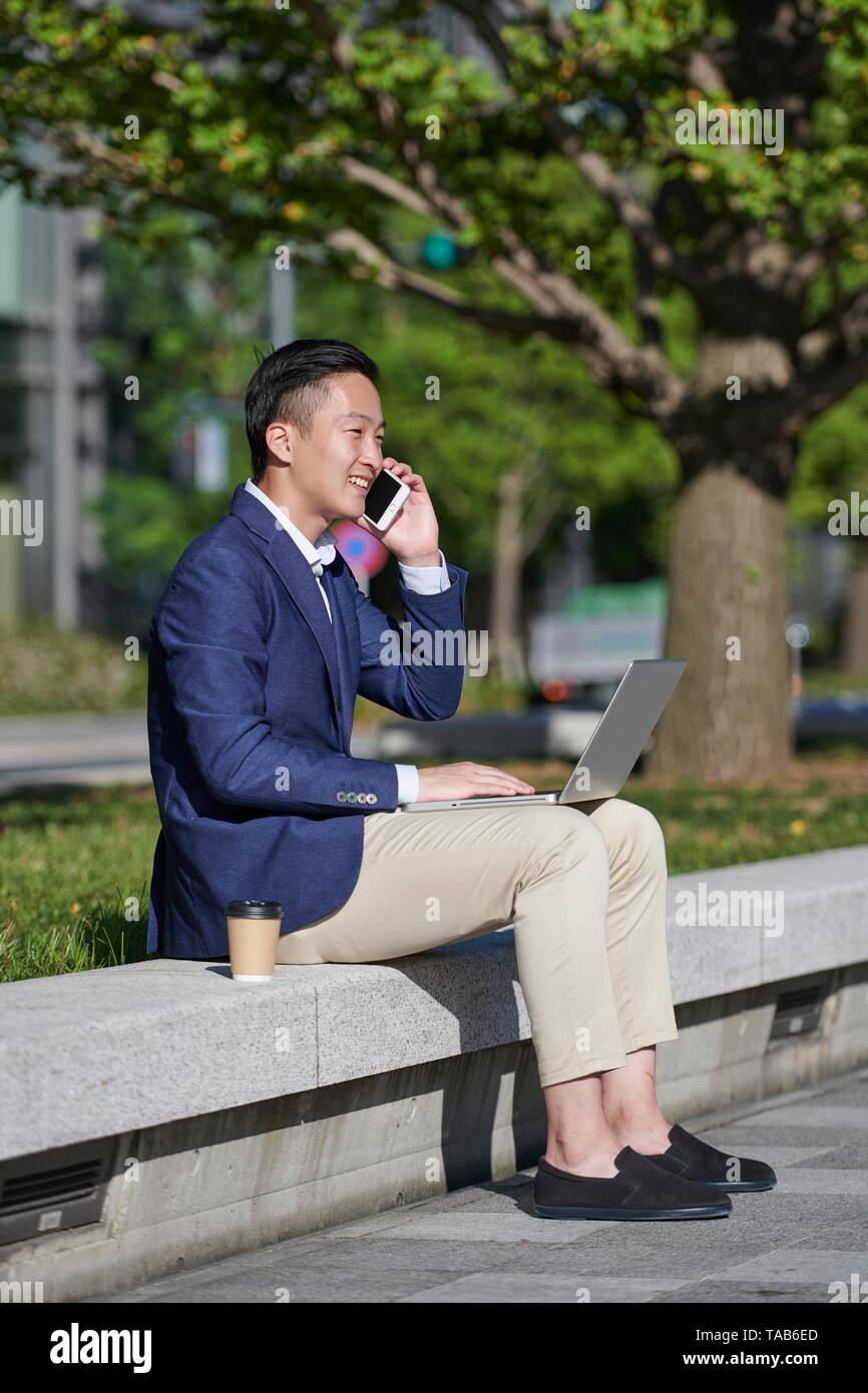 Young Japanese businessman downtown Tokyo Stock Photo - Alamy