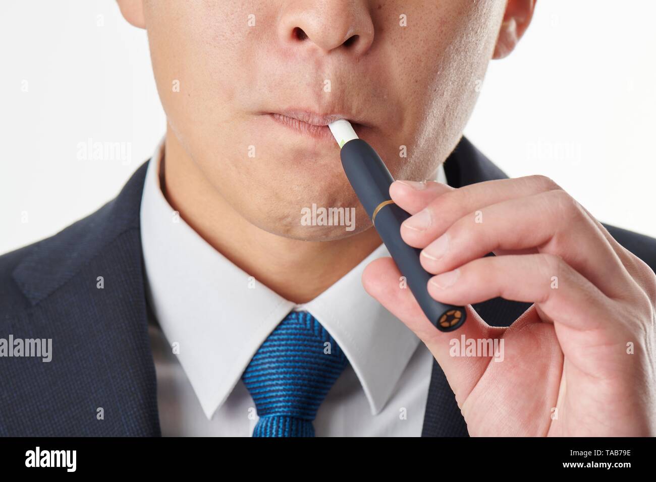 Young Japanese man smoking electronic cigarette Stock Photo - Alamy