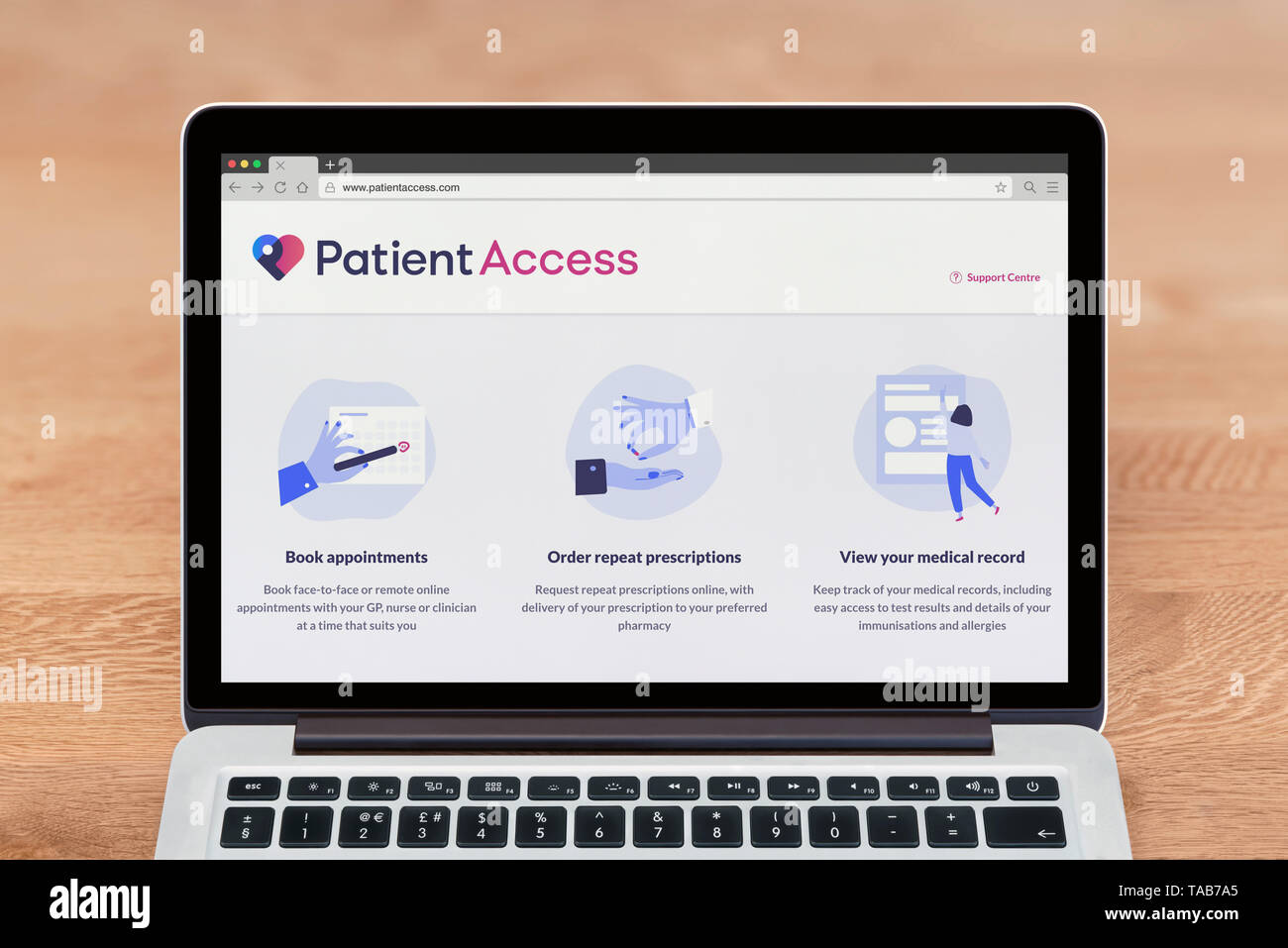 An Apple Macbook displays the Patient Access website (Editorial use ...