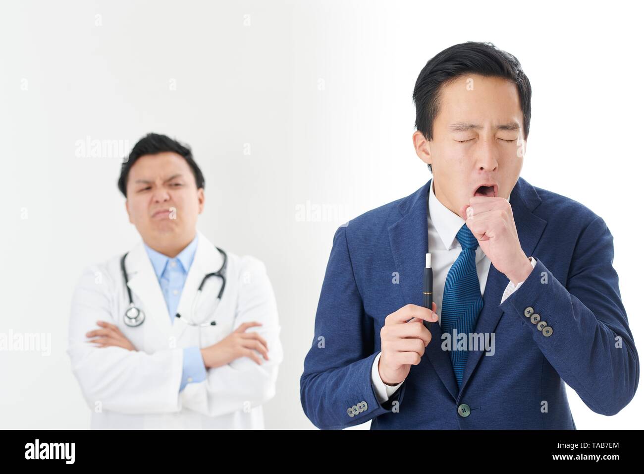 Young Japanese man smoking electronic cigarette Stock Photo - Alamy