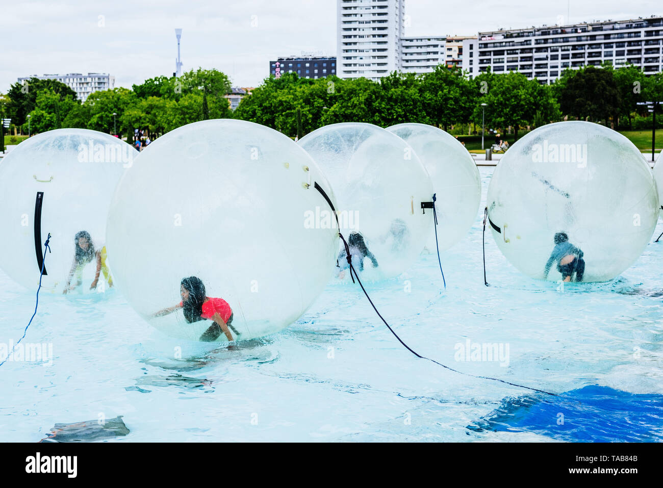Children fun inside plastic balloons hi-res stock photography and ...