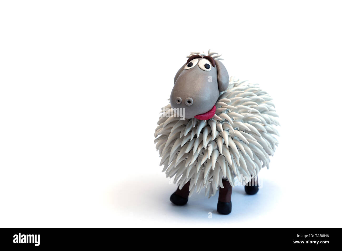Modeling clay sheep on white background Stock Photo - Alamy