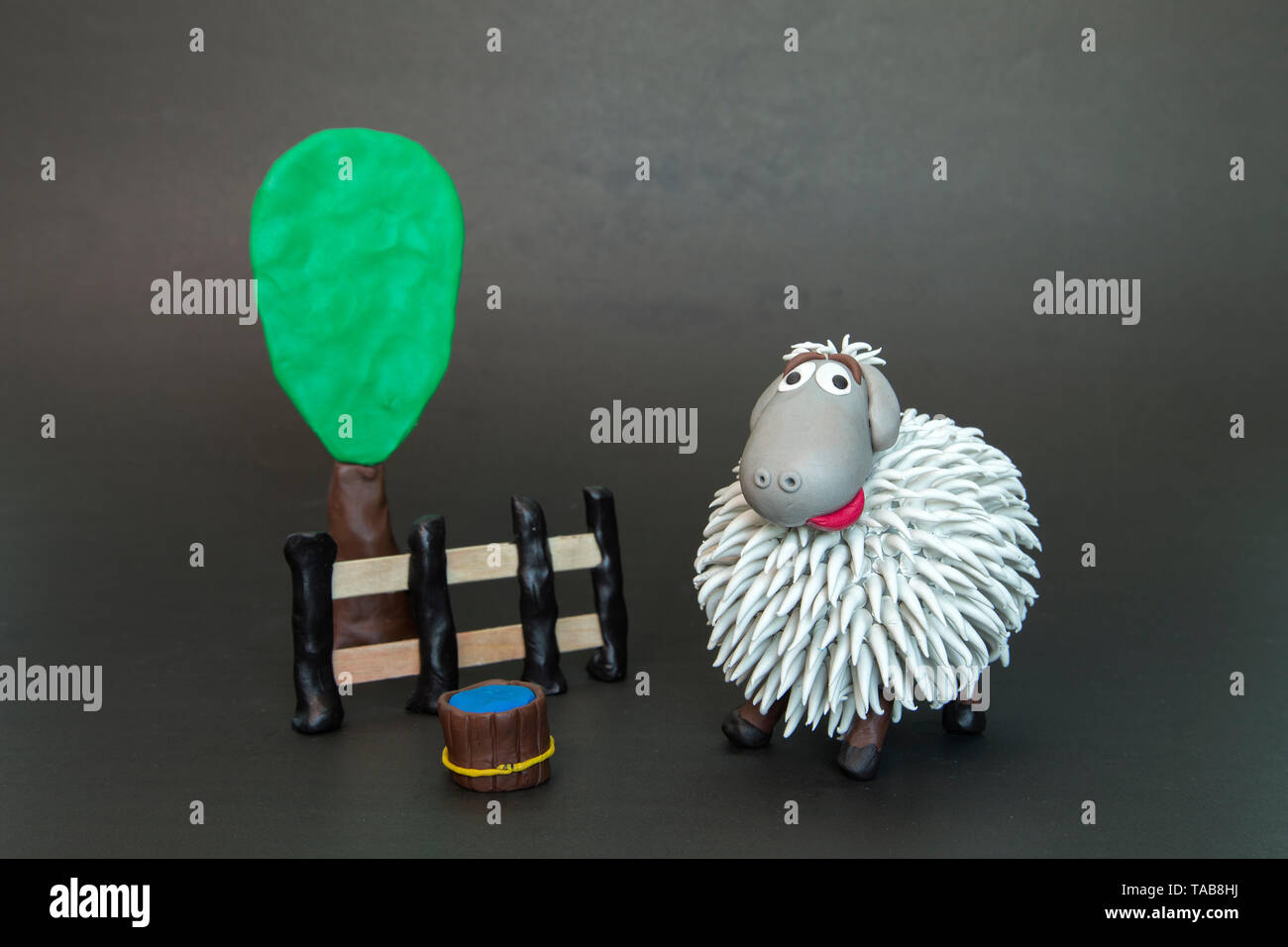 Modeling clay sheep farm on black background Stock Photo - Alamy