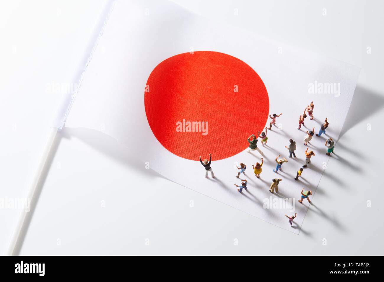 Miniature figures cheering Stock Photo - Alamy