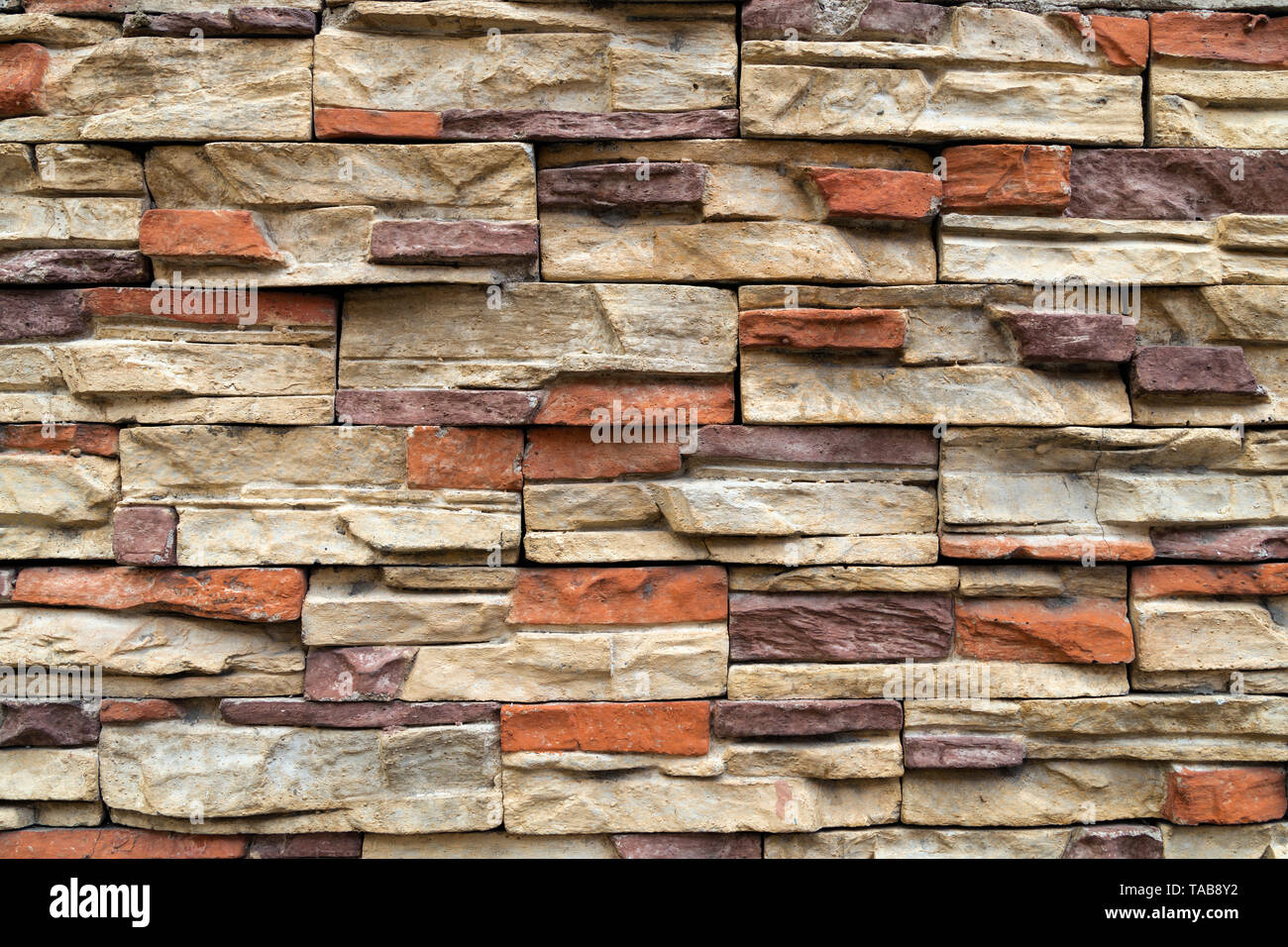Texture wallpaper of uneven brick stone wall Stock Photo - Alamy