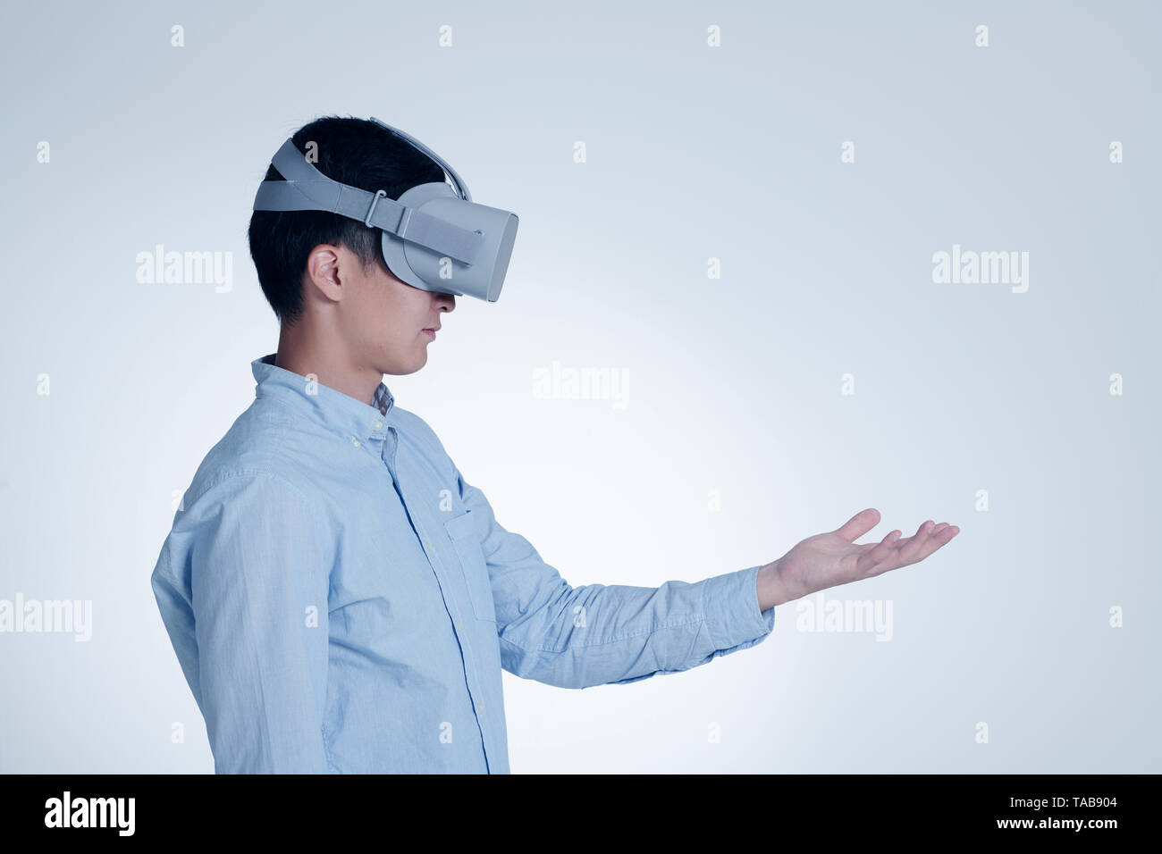 Young Japanese man using VR goggles Stock Photo - Alamy