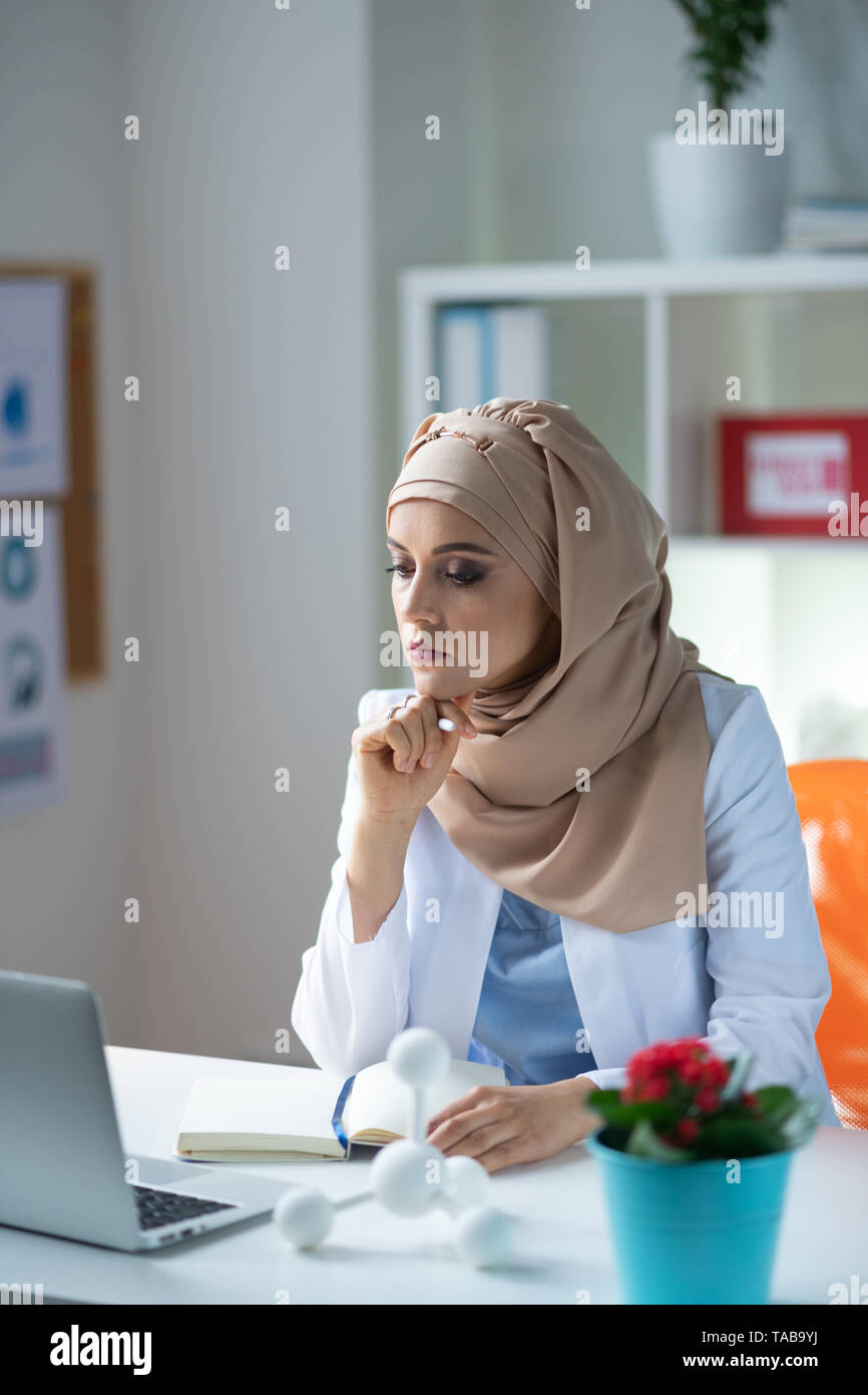 Muslim woman doctor overloaded work hi-res stock photography and images ...