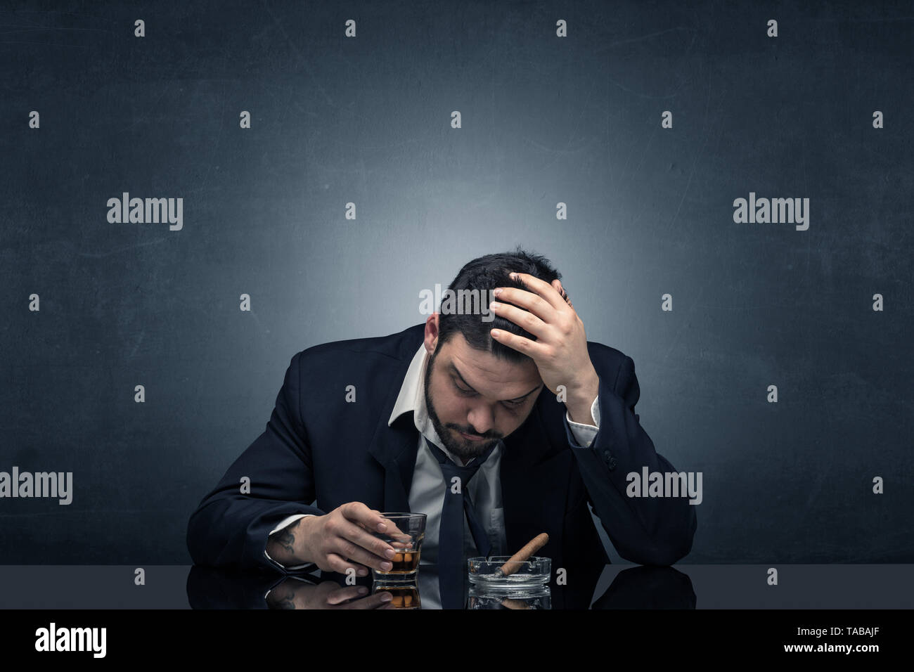 Young drunk man at his office with free dark copyspace Stock Photo - Alamy