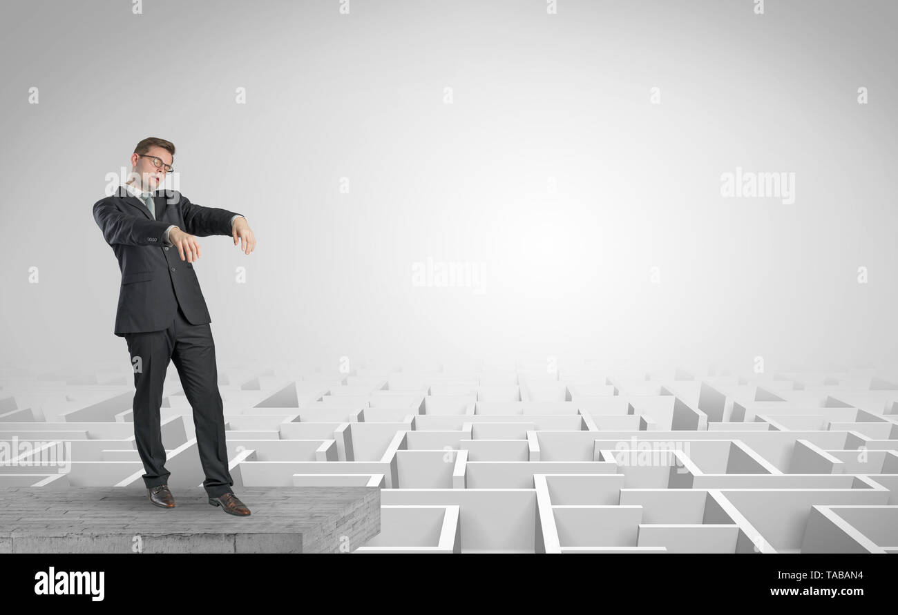 Zombi elegant businessman on the top of a labyrinth Stock Photo - Alamy