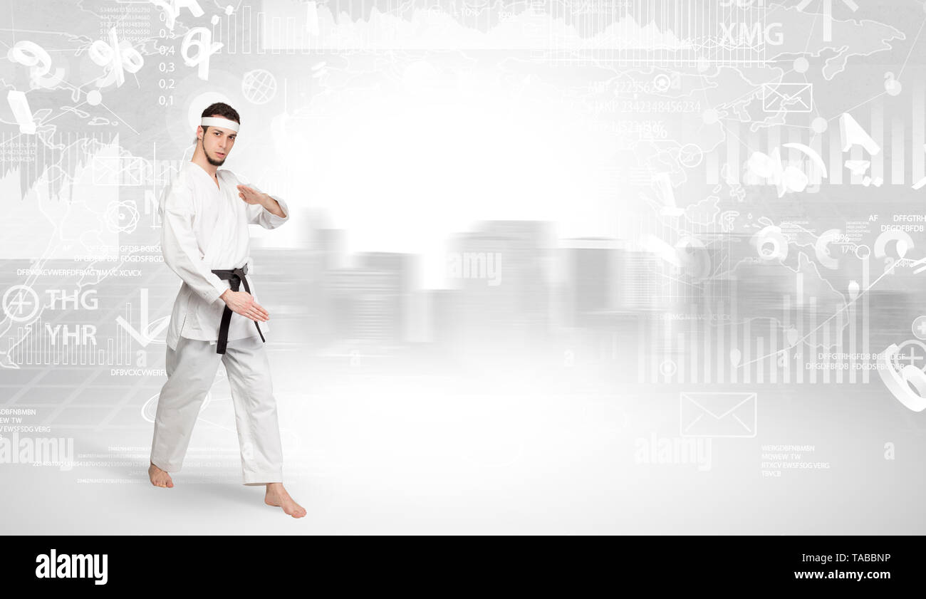 Young karate trainer doing karate tricks on the top of a metropolitan ...