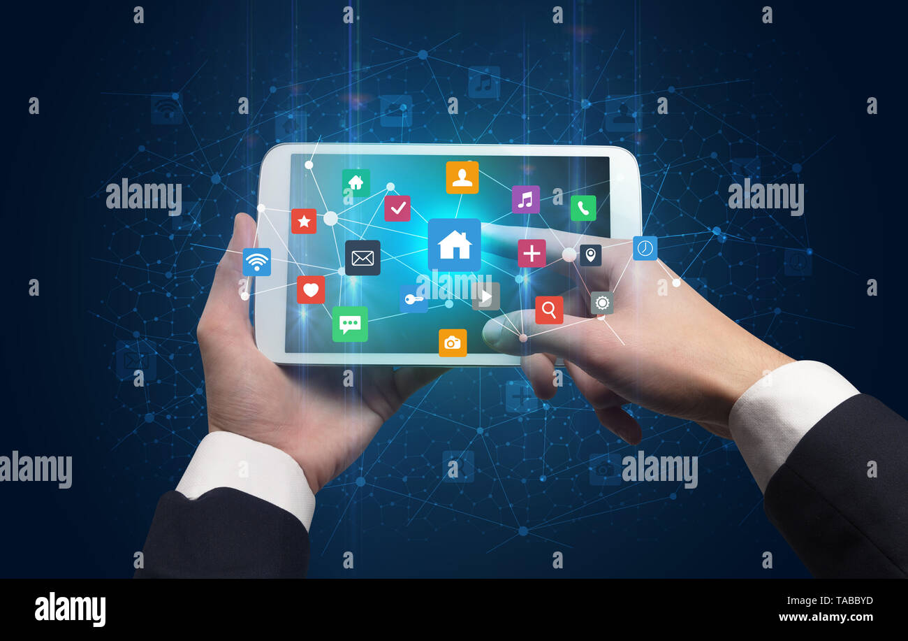 Hand using tablet with colorful bounce application symbols and icons ...