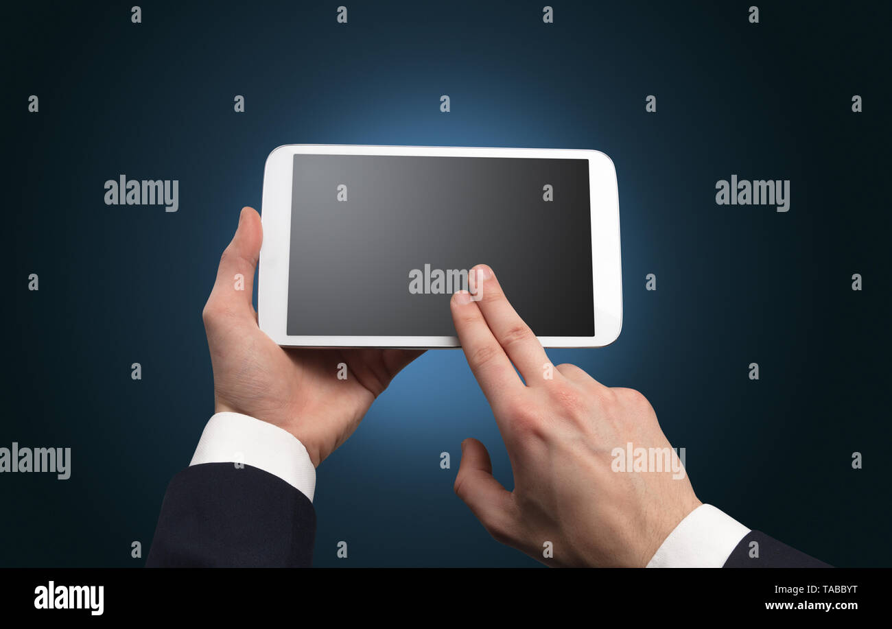 Hand using tablet with no concept and empty space Stock Photo - Alamy