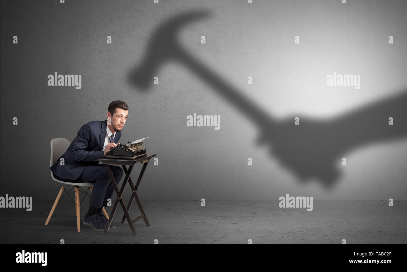 Shadow threatening hard worker man who is afraid Stock Photo - Alamy