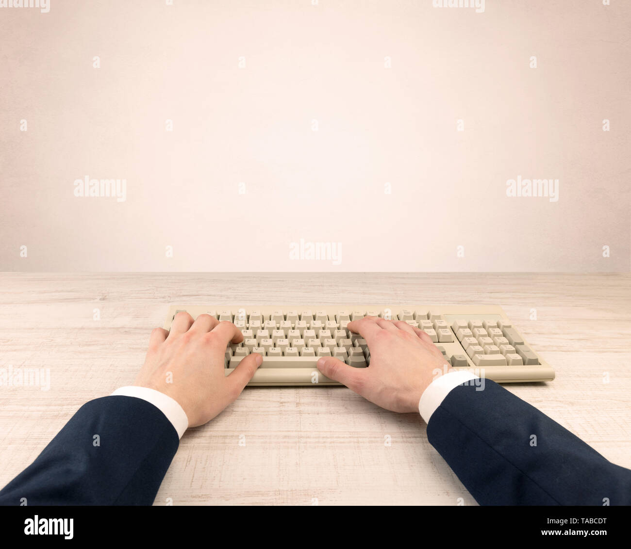 First person view of an elegant businessman hand typing on light ...