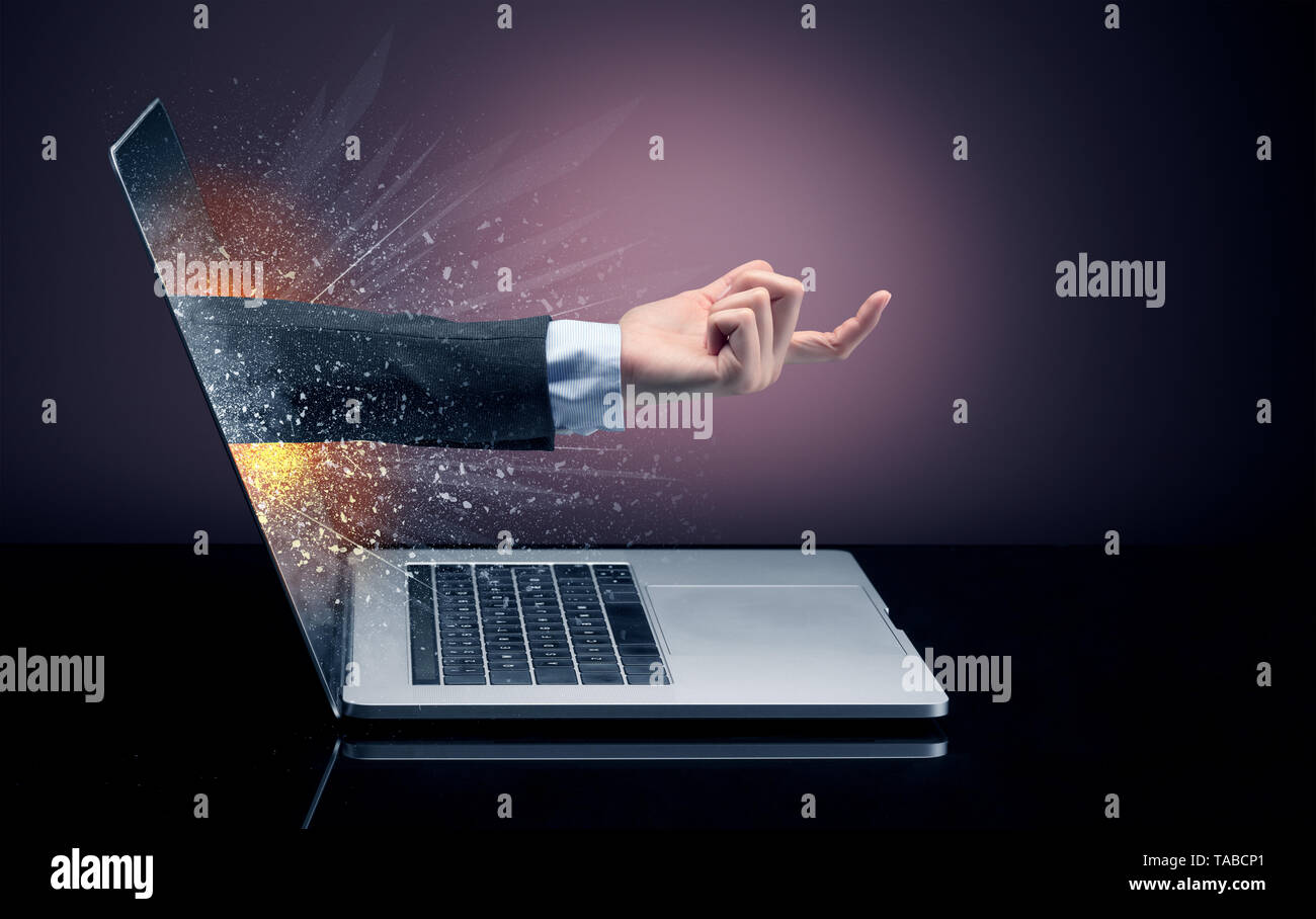 Hand coming out of a laptop with sparkling effects Stock Photo - Alamy