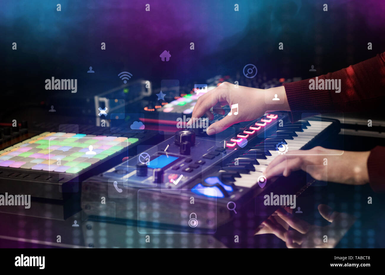 Hand mixing music on dj controller with social media concept icons ...