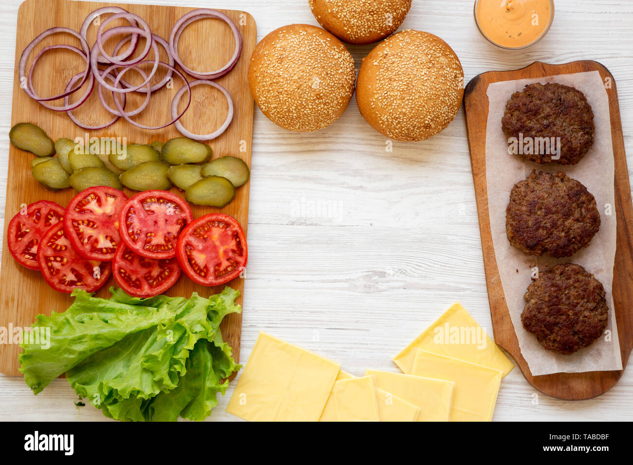 Frame of cheeseburger ingredients, top view Stock Photo - Alamy