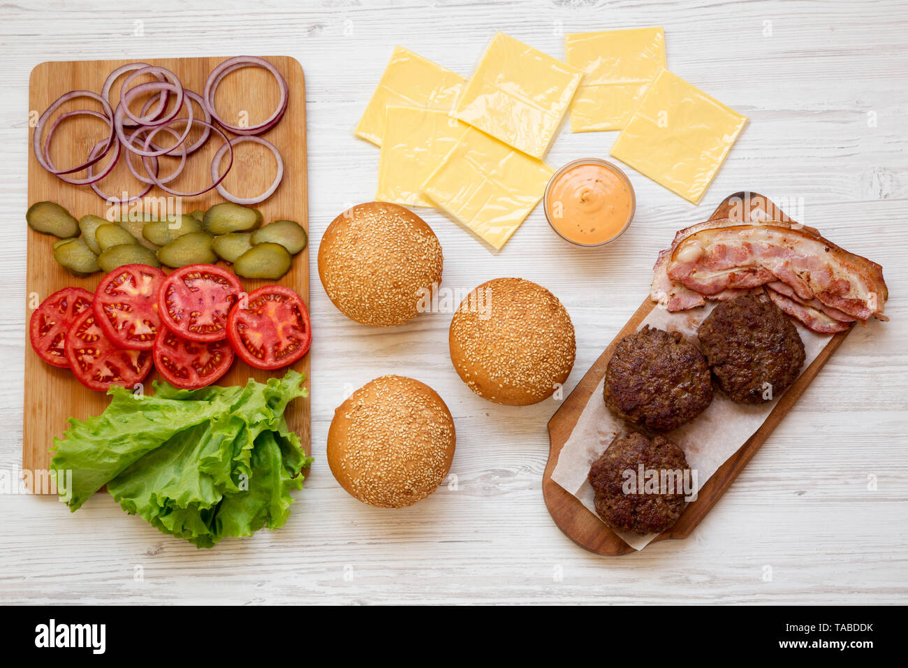 Cheeseburger ingredients, top view. From above, overhead, flat lay ...