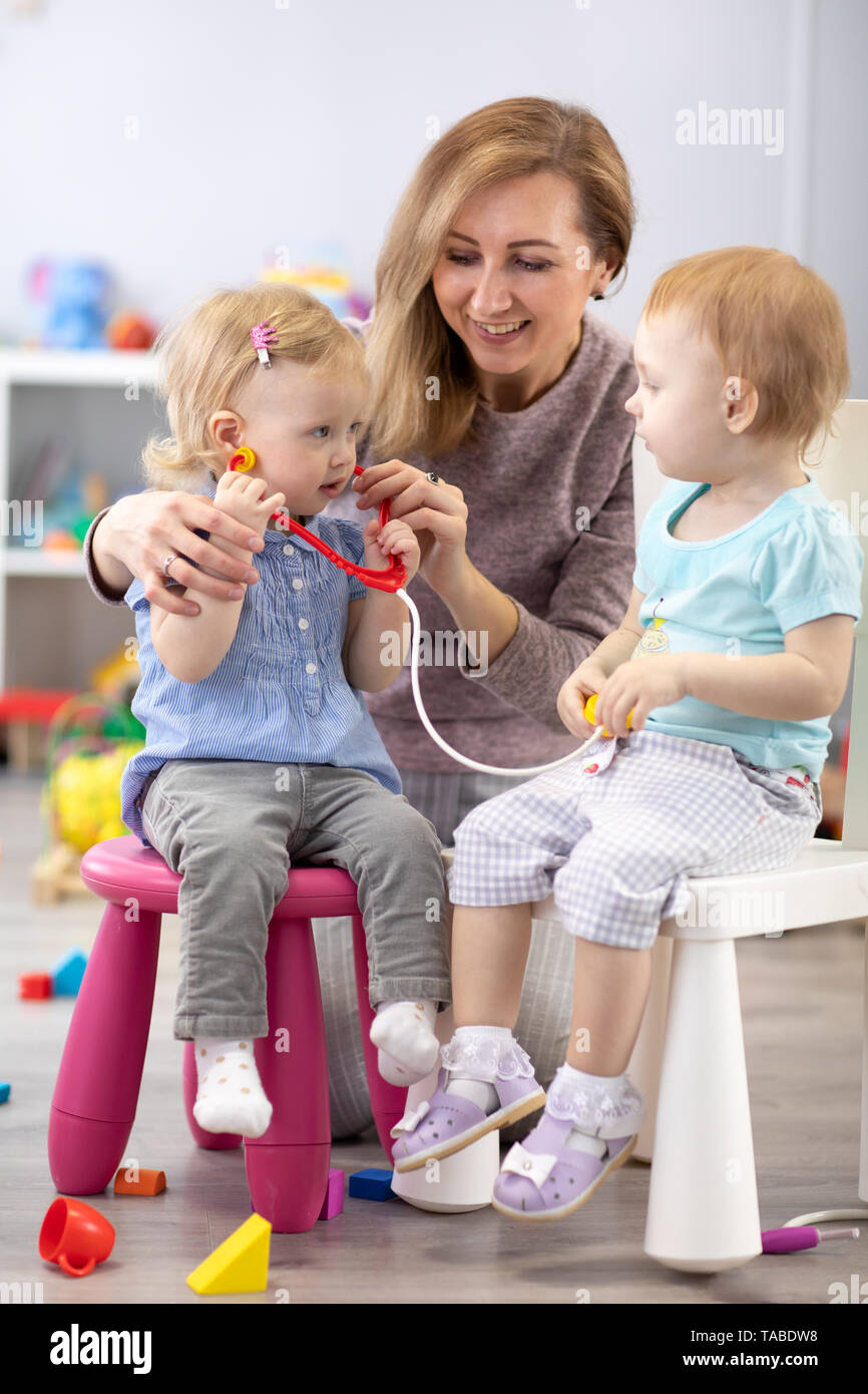 Doctor children game kindergarten hi-res stock photography and images ...