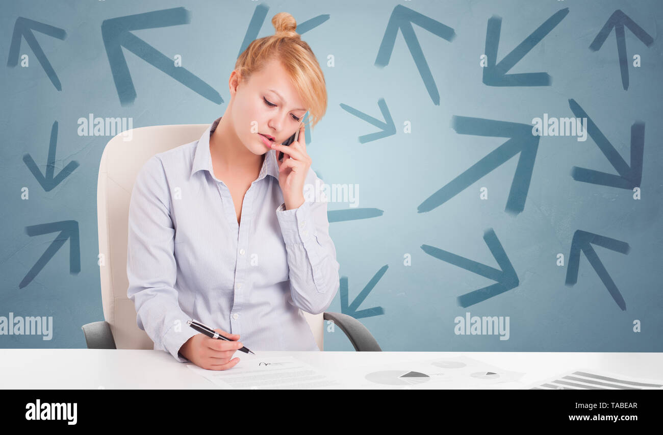 Business person sitting at desk with different direction concept Stock ...