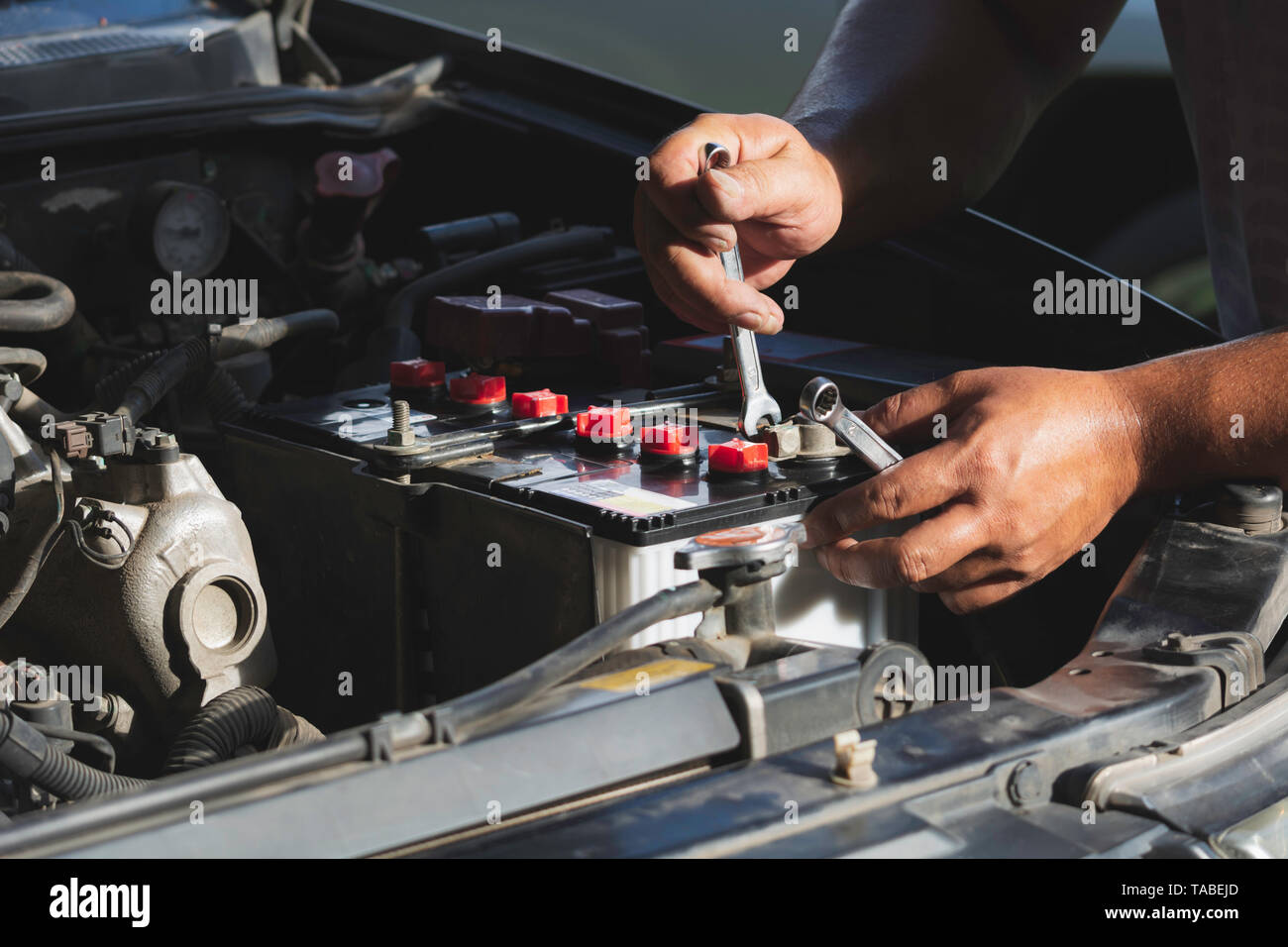 Technician checking engine of car. Auto mechanic checking car engine ...