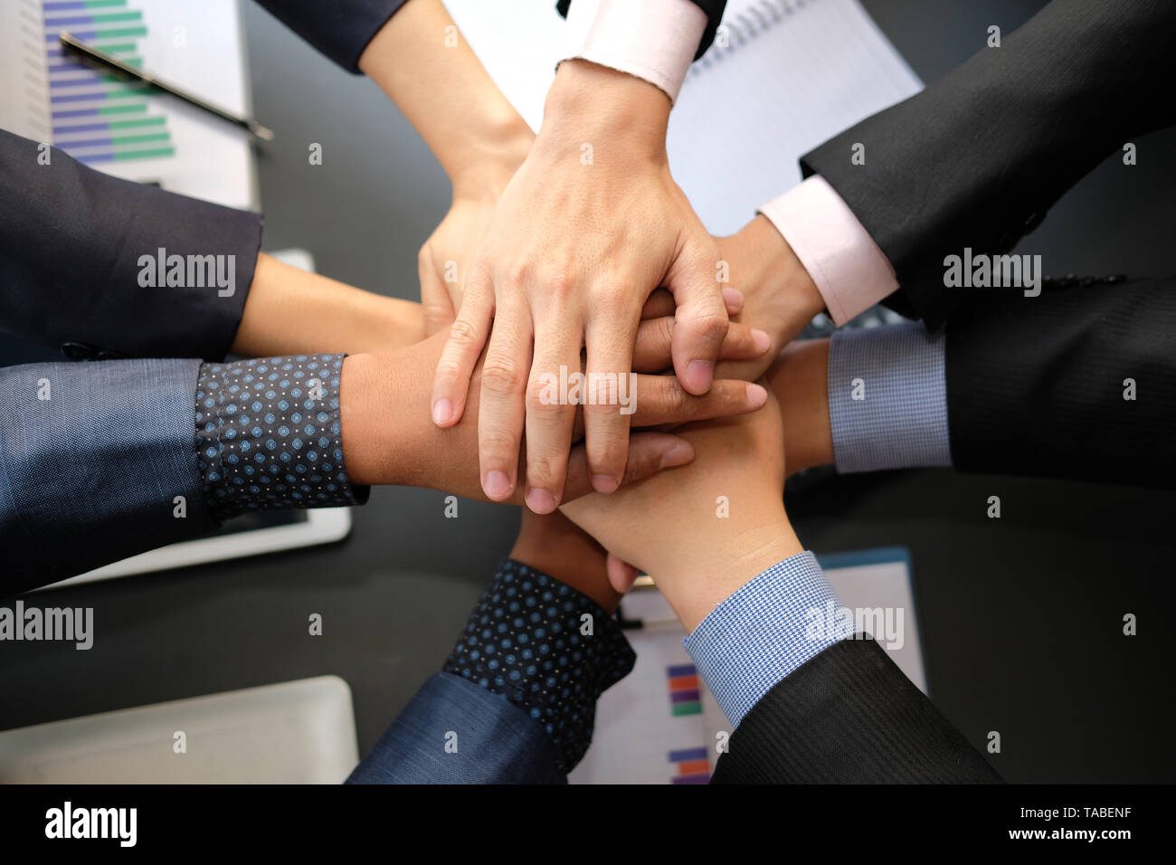 businessman joining united hand, business team touching hands together ...