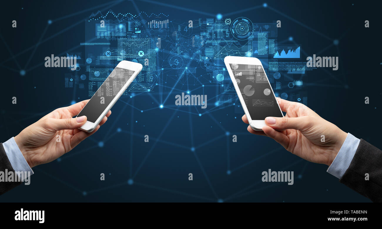 Close up of two hands holding smartphones to sync business data Stock ...