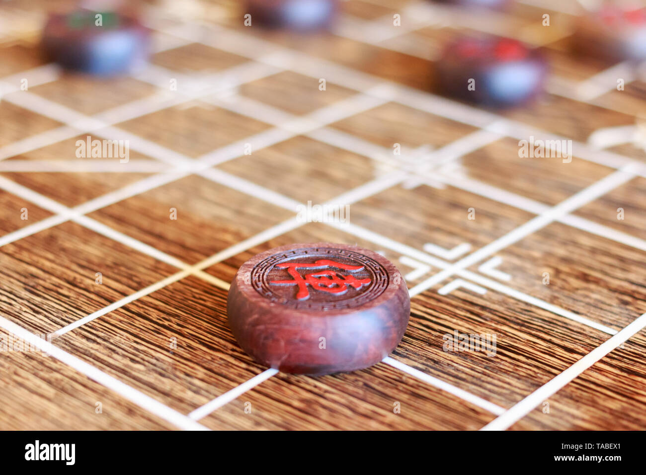 Wooden Chinese chess board and marker. The chinese character on marker ...