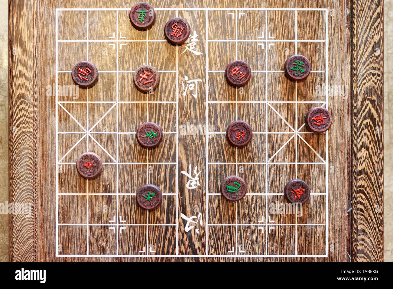 Wooden Chinese chess board and marker. The chinese character on marker ...