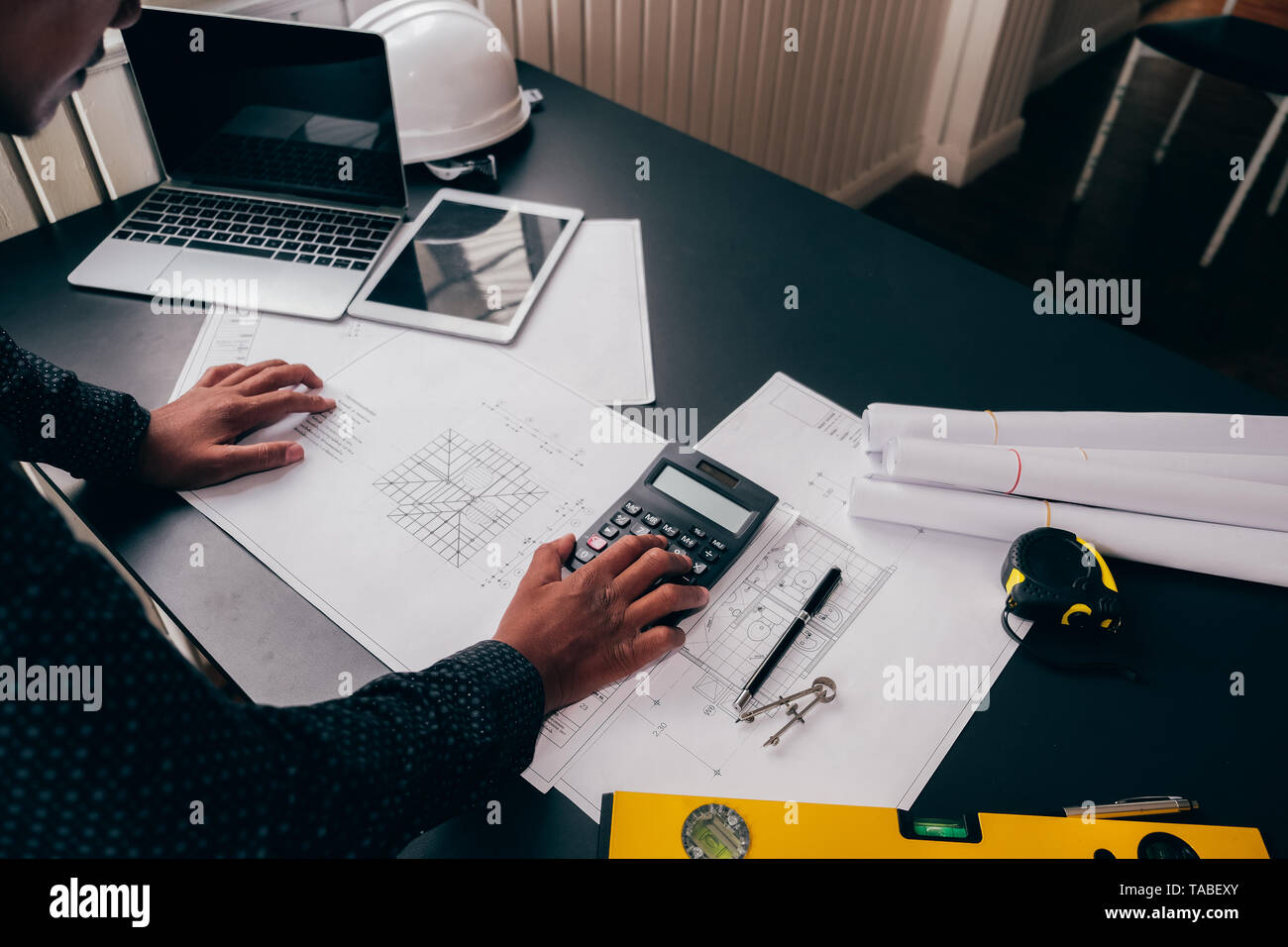 architect engineer working on house blueprint of real estate project at ...