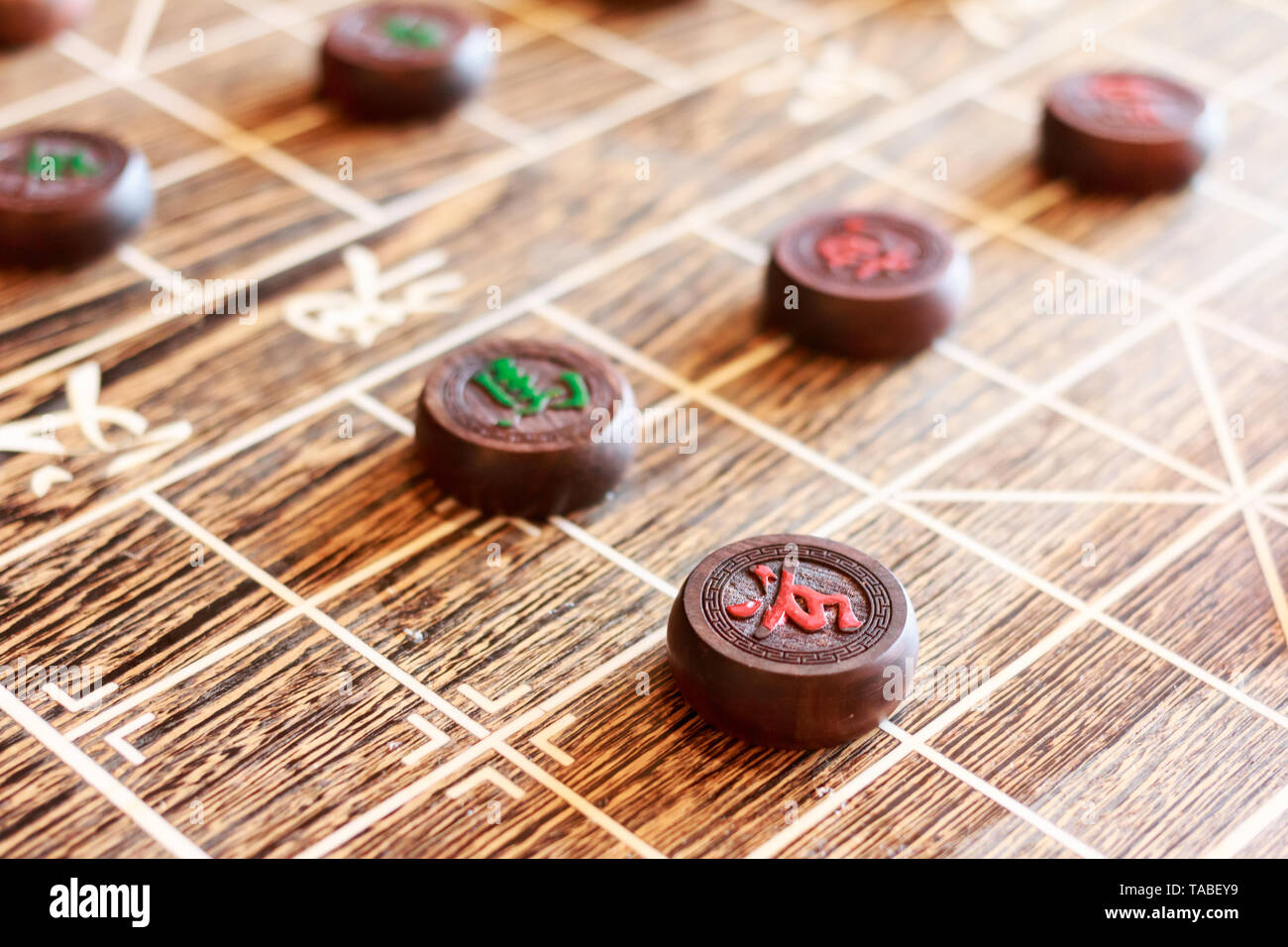 Wooden Chinese chess board and marker. The chinese character on marker ...