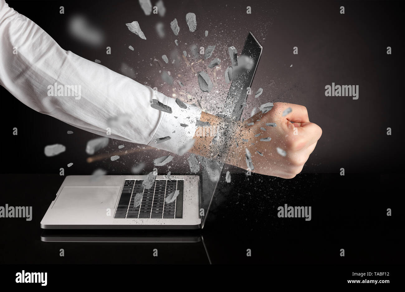 Strong male hand breaks laptop screen Stock Photo - Alamy
