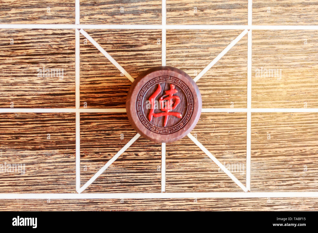 Wooden Chinese chess board and marker. The chinese character on marker ...