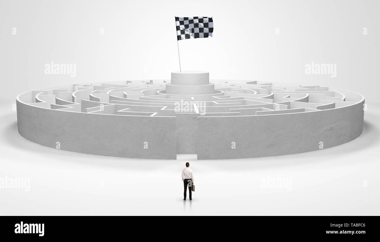 Man standing in front of a big round maze with flag Stock Photo - Alamy