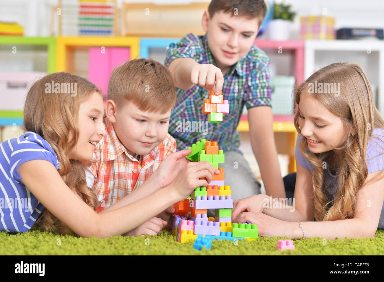 Portrait of group of children playing together Stock Photo - Alamy
